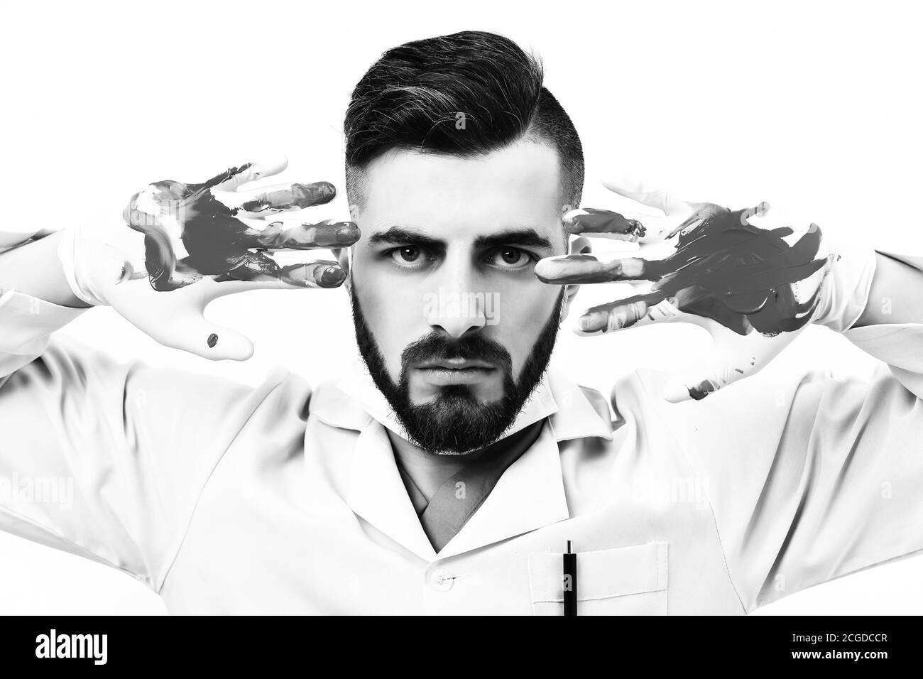 Doctor with angry face expression and dark beard shows blood on his ...