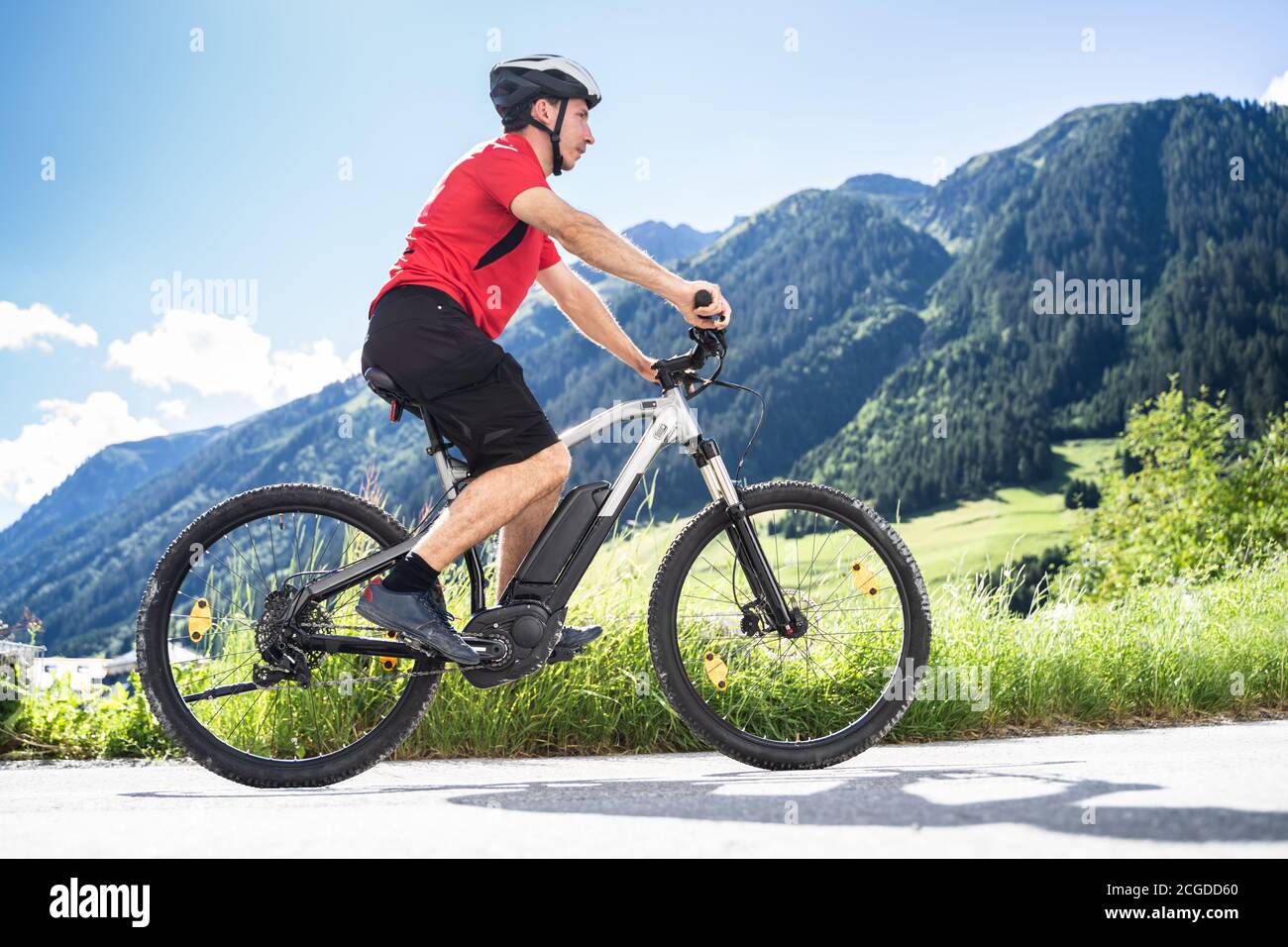 Man on electric bike hi-res stock photography and images - Alamy