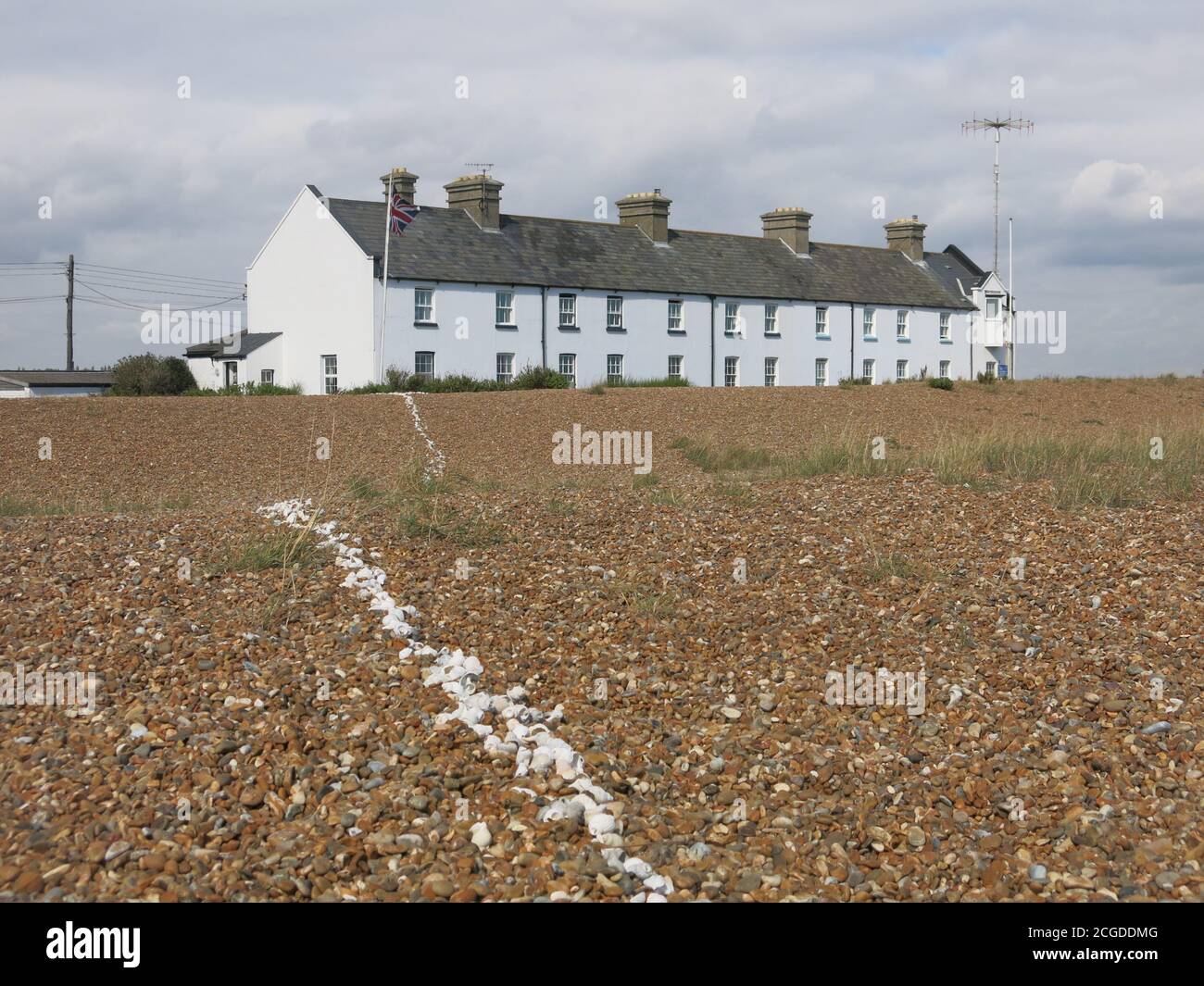 A line of white whelk shells leads from the row of cottages at Shingle ...