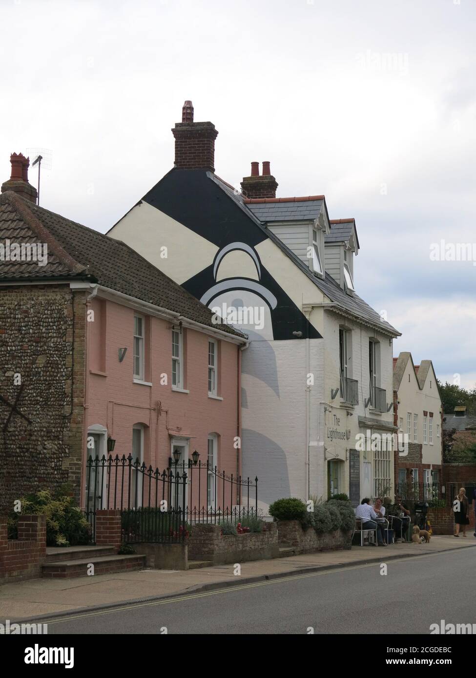 Street scene in the Suffolk coastal town of Aldeburgh with a lighthouse ...