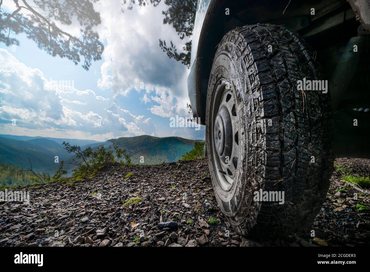 mountain top view, landscape and sky, driving a four-wheel drive car ...