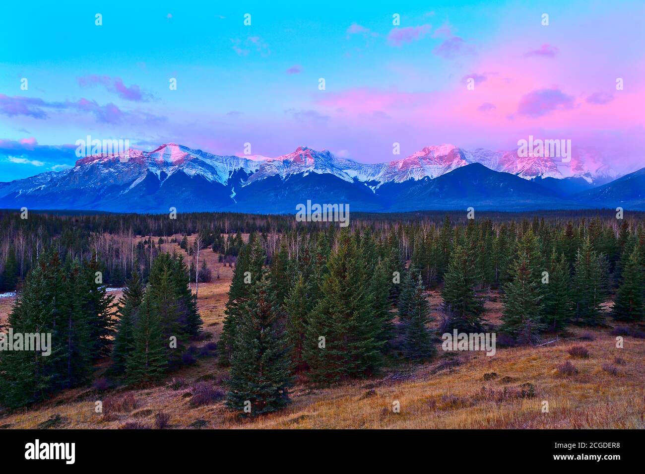 A stunning early morning alpenglow on the eastern slopes of the rocky ...