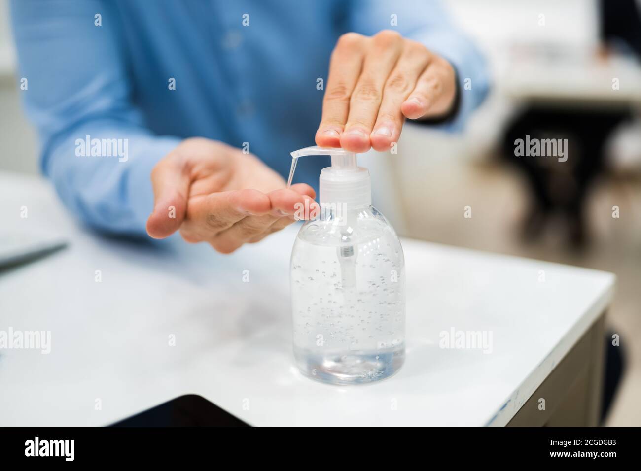 Man Using Alcohol Rub Gel Or Handwash Disinfectant Stock Photo - Alamy