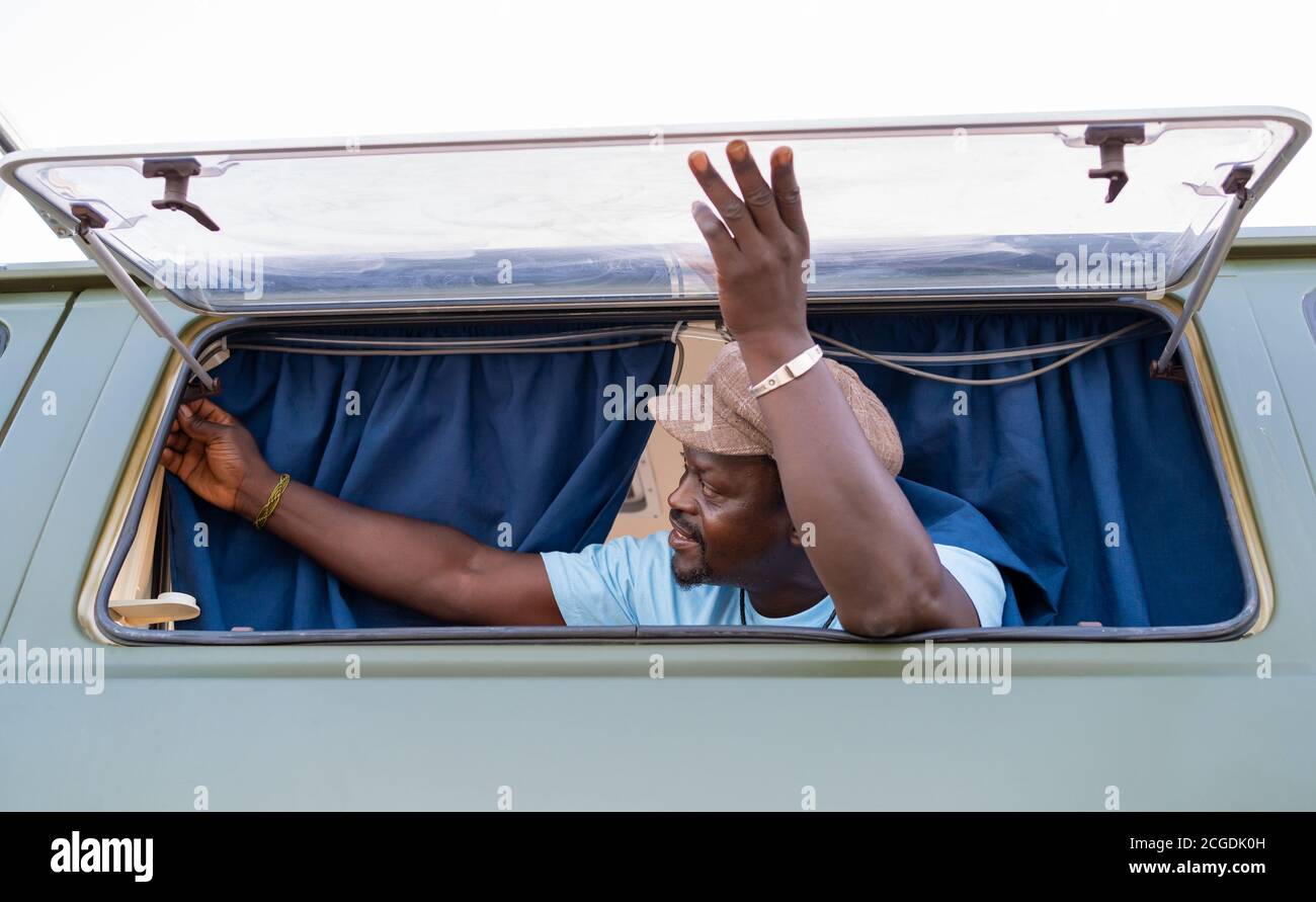 black african american man in the window of his camper van Stock Photo ...