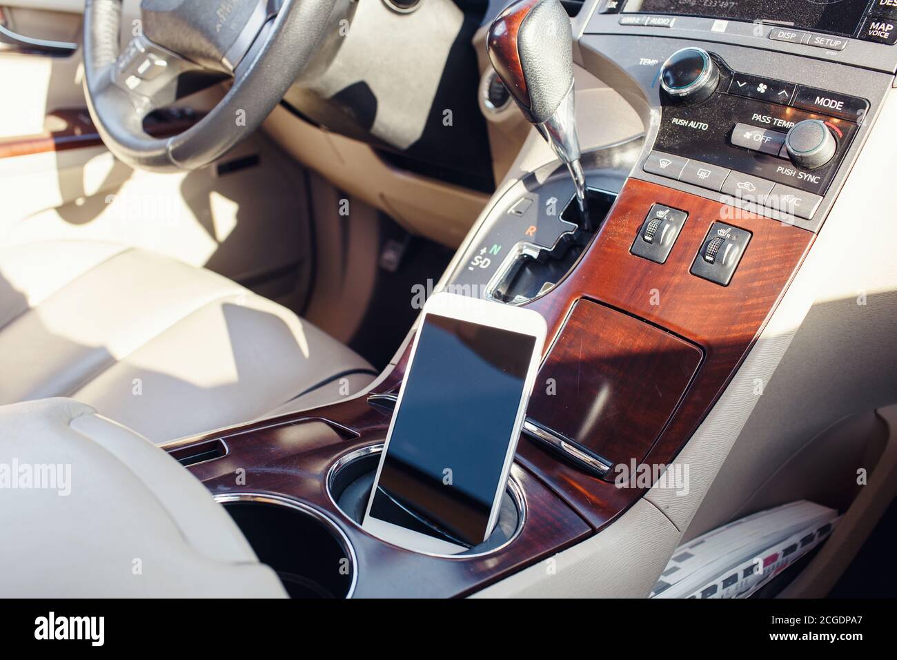 smart phone phone on the car seat dashboard. Lifestyles photo in car ...