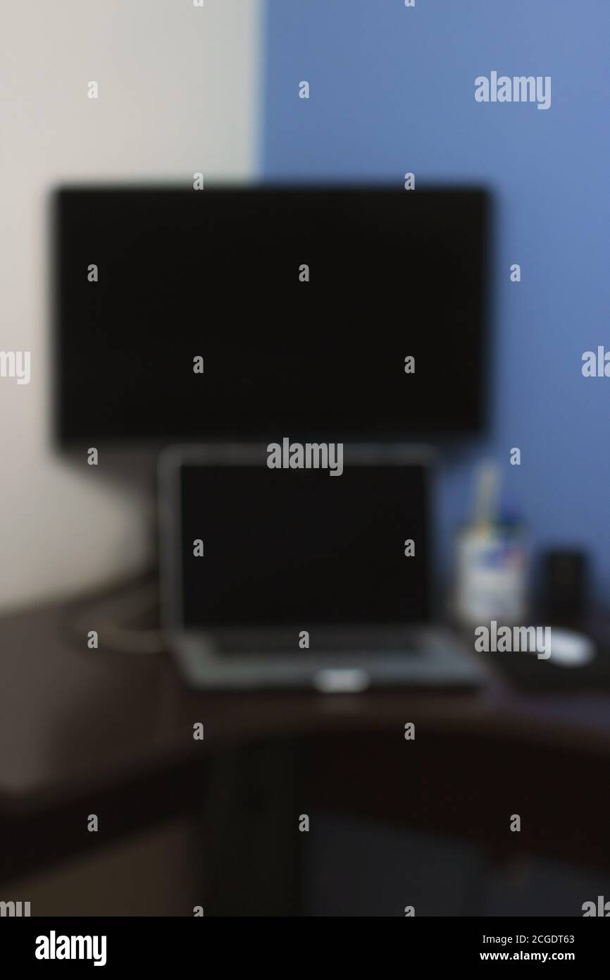 Blurred interior of Office with Computer on brown desk place. Modern ...