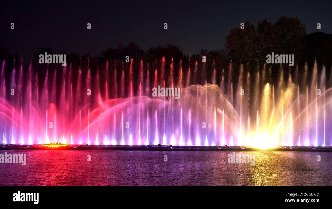 Selective focus. Night laser fountain show, on the Roshen embankment ...