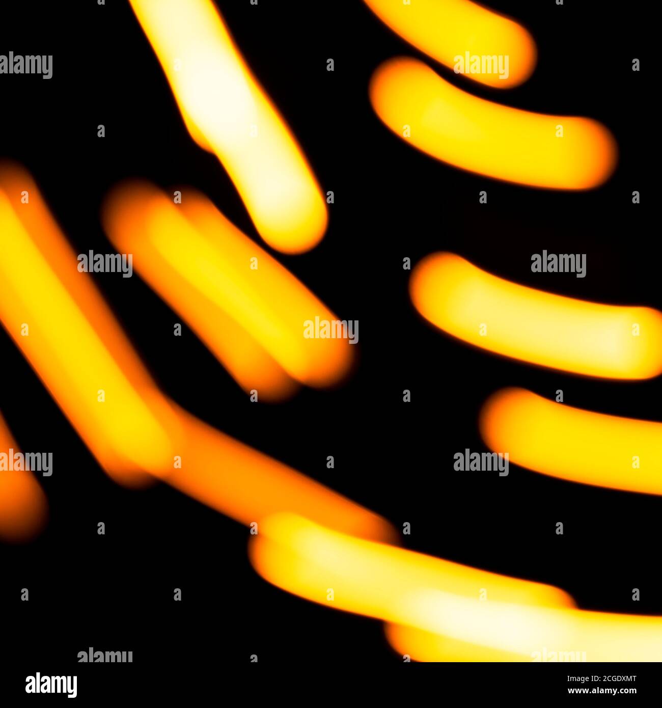 Blurred moving fire lights background, yellow, orange and white colors ...