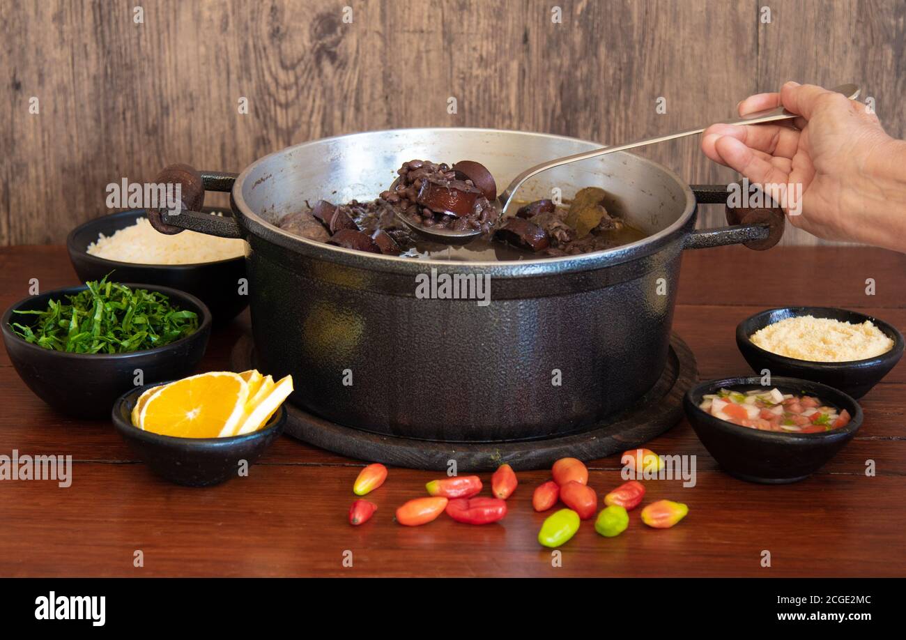 Feijoada. Traditional Brazilian food. Wood background Stock Photo - Alamy