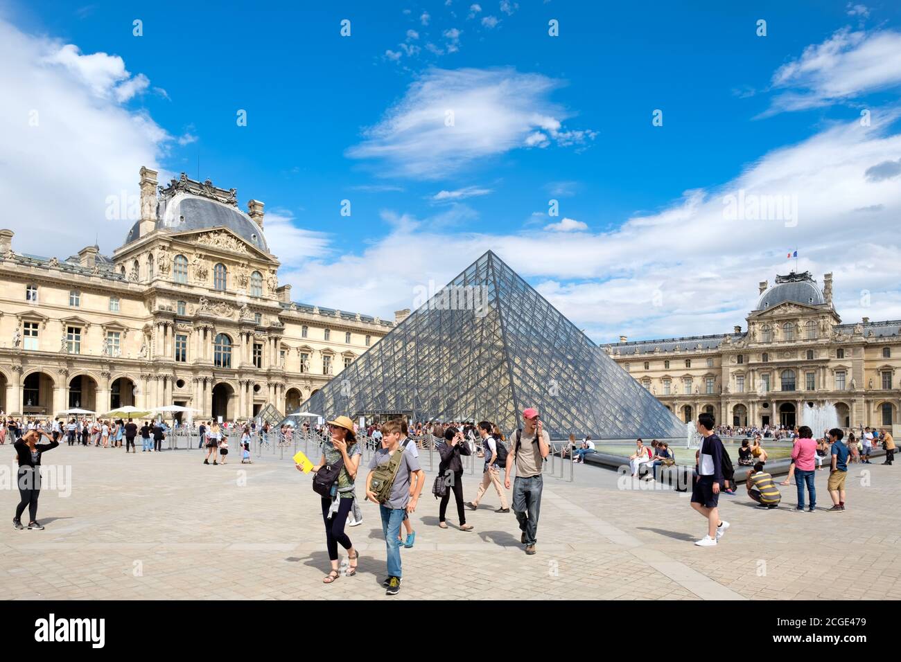 The Louvre Museum in Paris on a beautiful summer day Stock Photo - Alamy