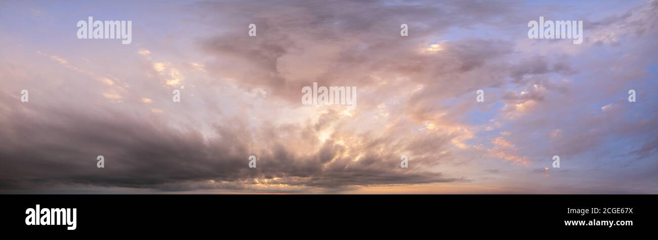Fluffy clouds in evening overcast sky panoramic view. Climate ...