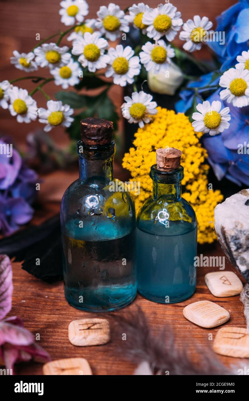Magic potion bottle. Witchcraft halloween concept with potions, herbs ...