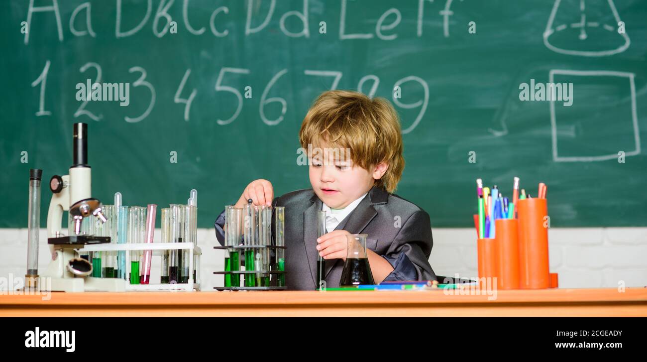 little boy at lesson. Back to school. Biology school laboratory ...