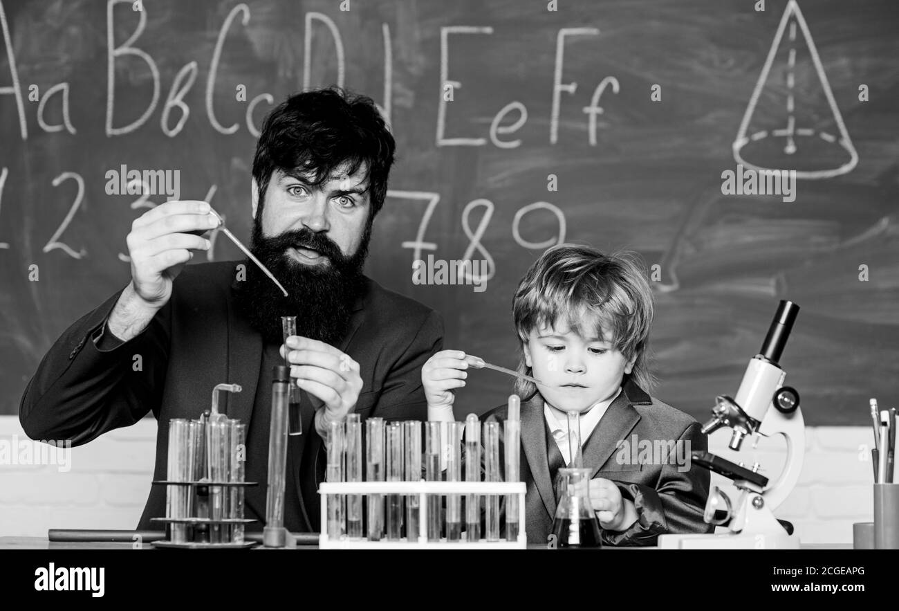 Scientist research and experiments father and son at school. learning ...