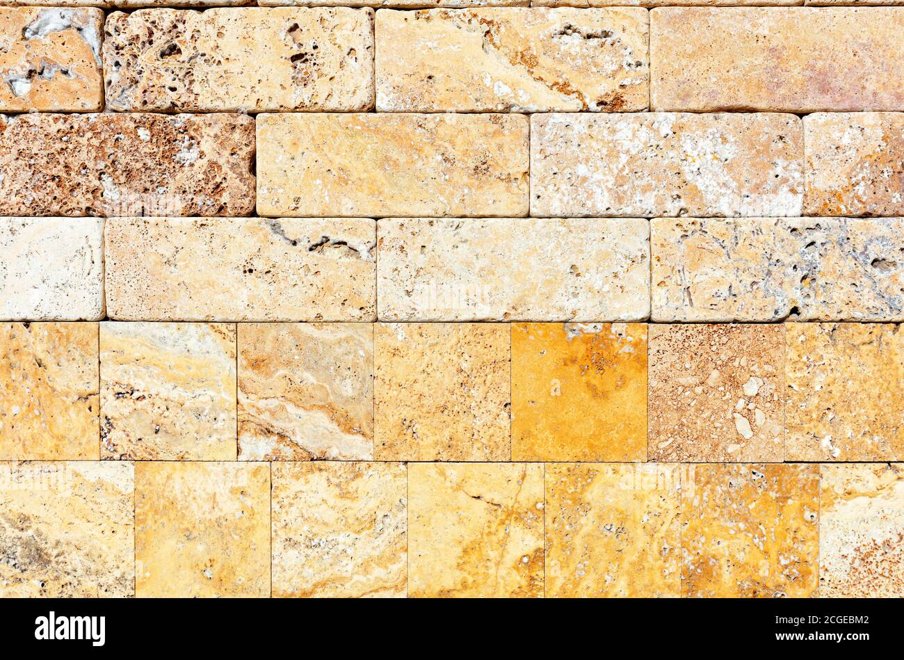 Wall background and texture of hewn yellow seashell stone, close-up ...