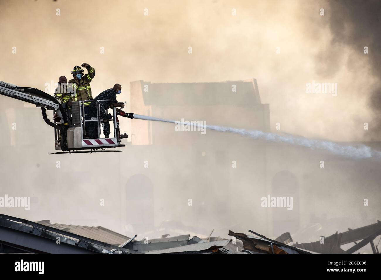 Beirut, Lebanon, 10 September 2020. Firefighters spray water on flames ...