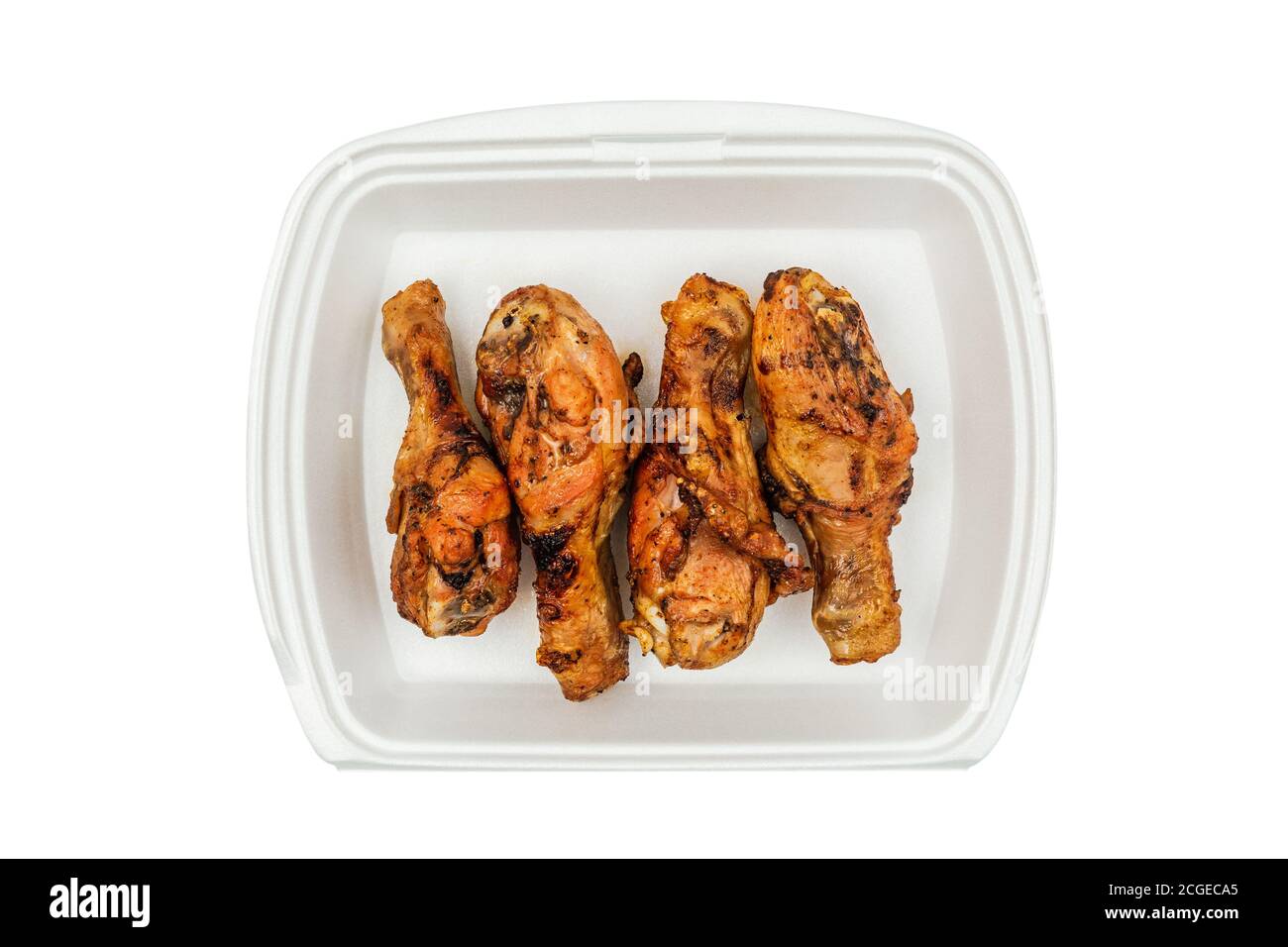 Grilled chicken legs in a white box, top view, isolated Stock Photo - Alamy