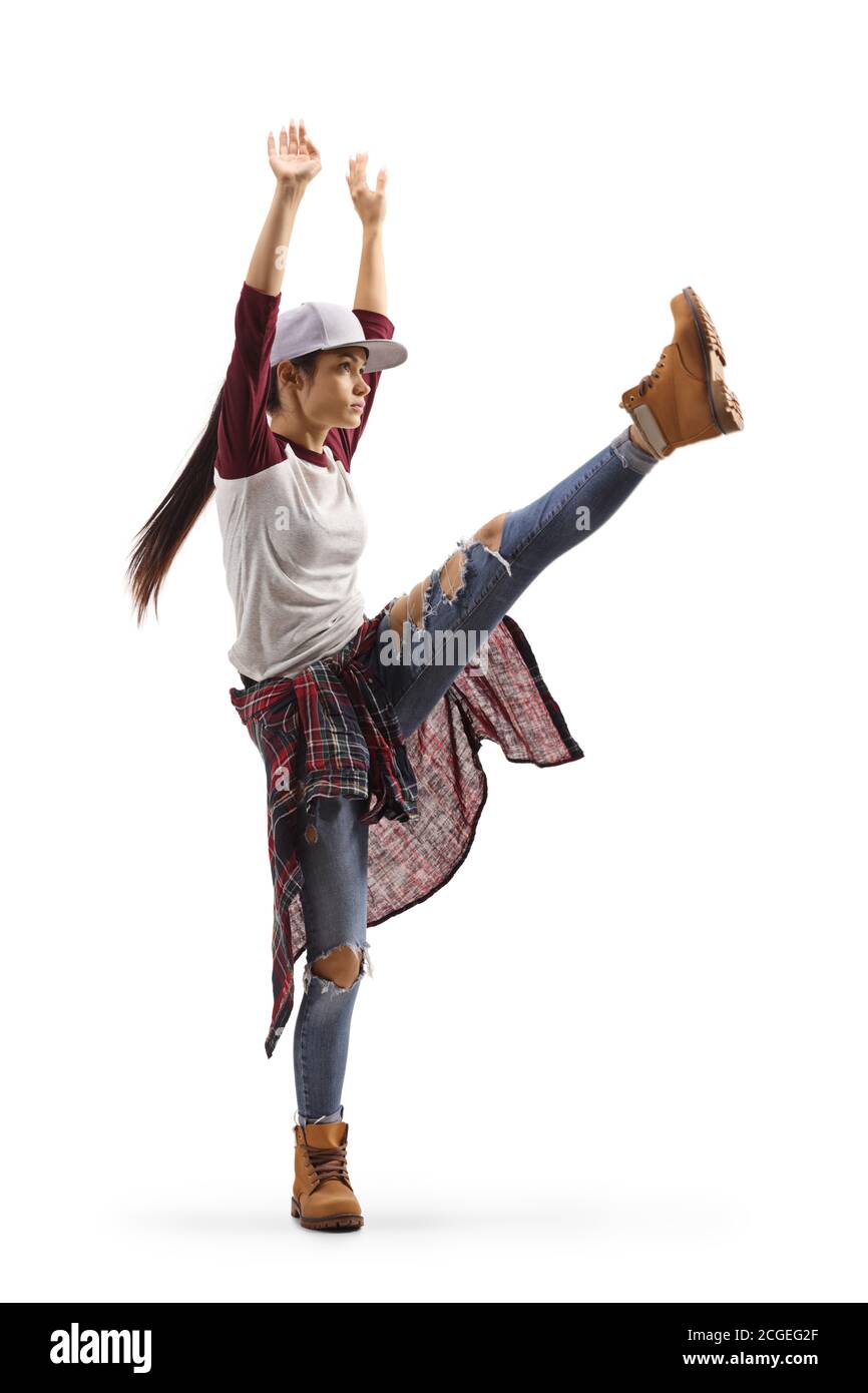 Full length profile shot of a female dancing hip-hop with one leg ...