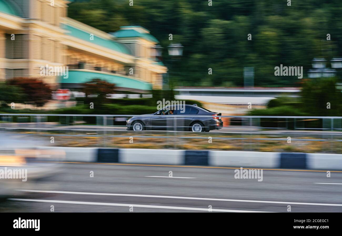 car is moving fast on a blurry background Stock Photo - Alamy