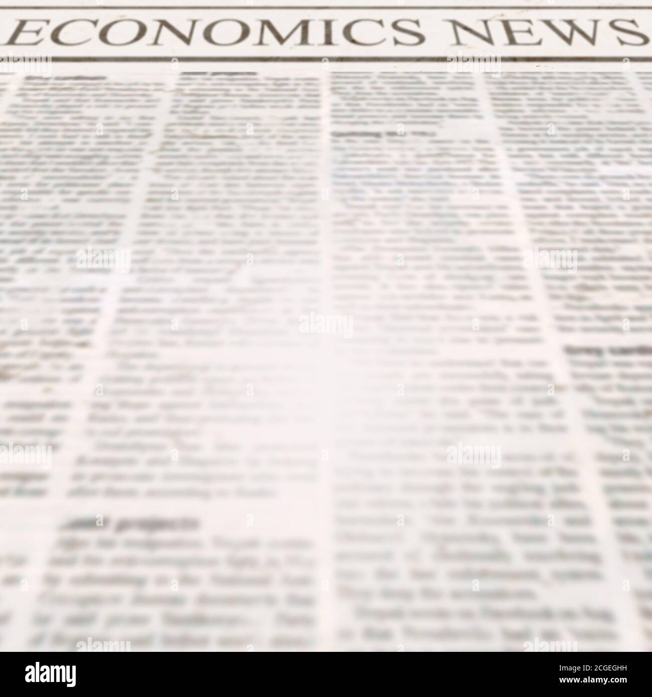 Newspaper with headline Economics News and old unreadable text. Vintage ...