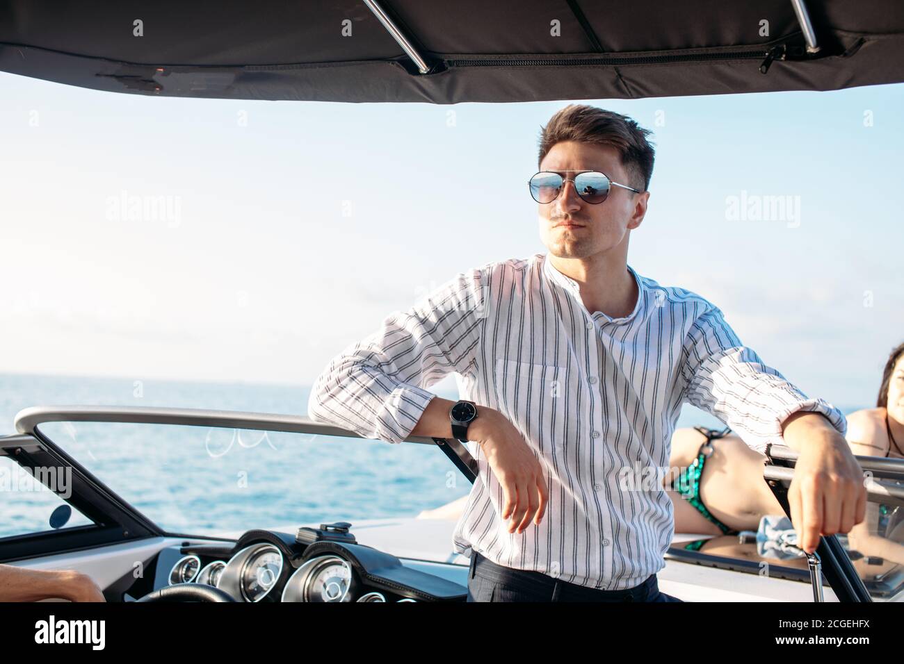 sailing, tourism, travel, business and people concept - handsome man on ...