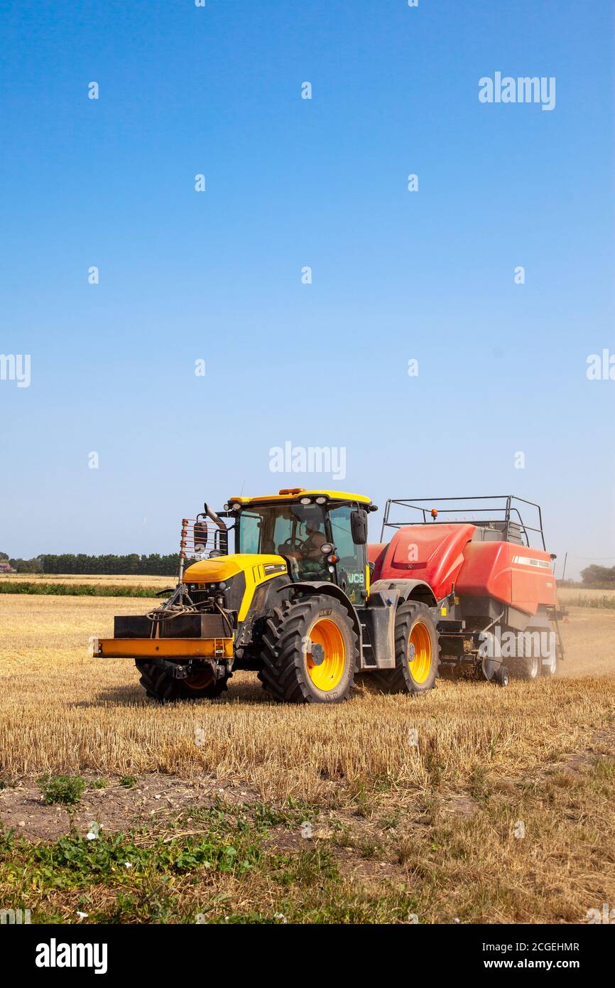 Tractor And Baler Stock Photo - Alamy