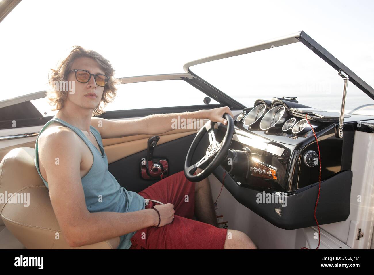 sailing, youth, vacation and tourism concept - happy young skiper man ...