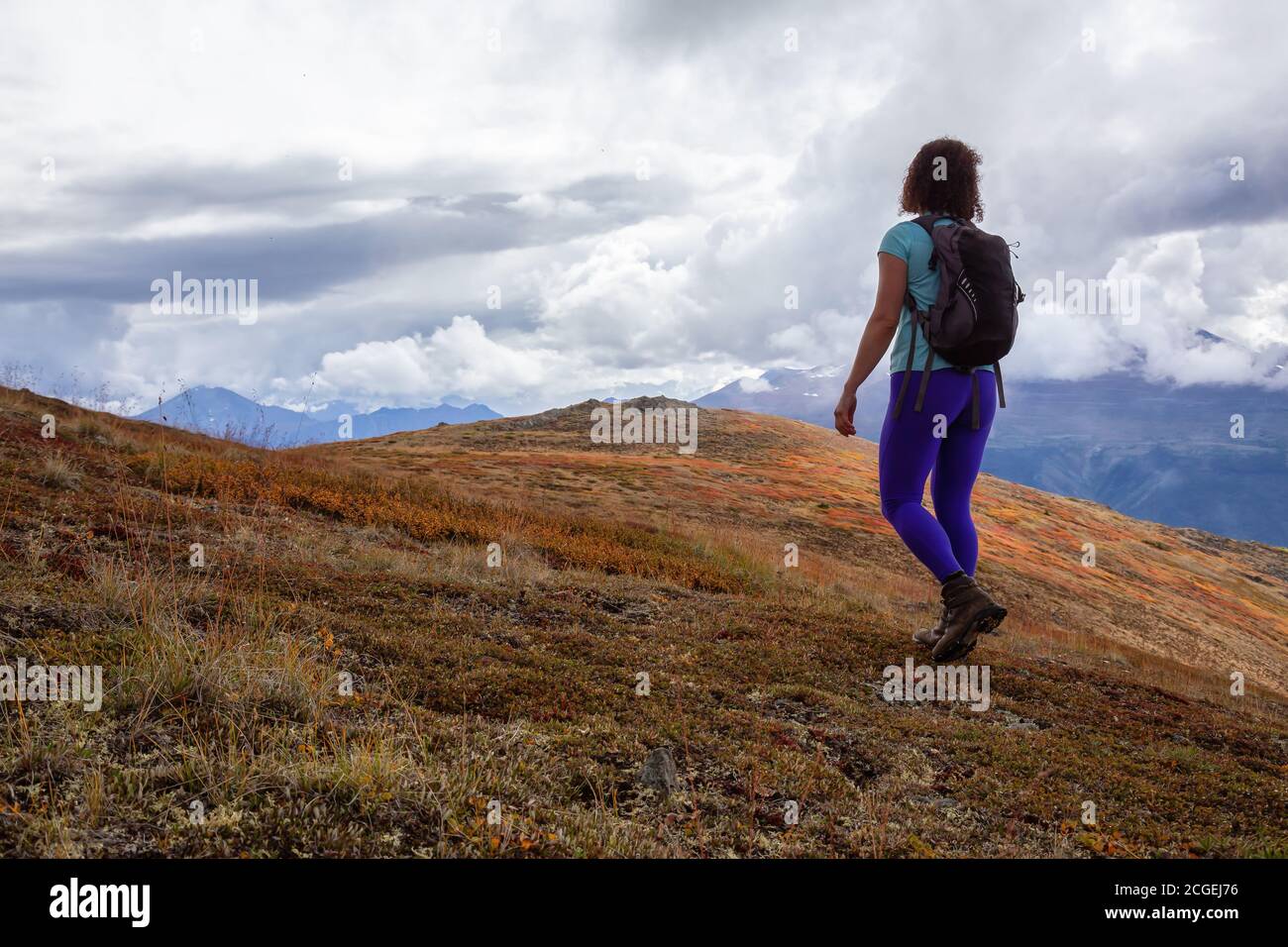 Adventurous Girl Hiking up the Nares Mountain Stock Photo - Alamy