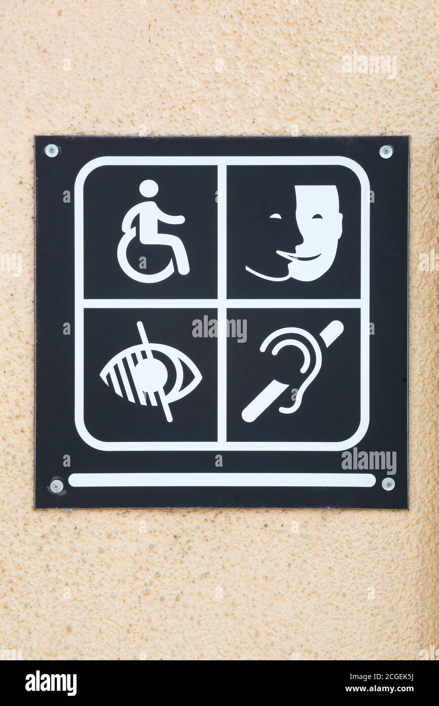 Disabled symbols on a wall Stock Photo - Alamy