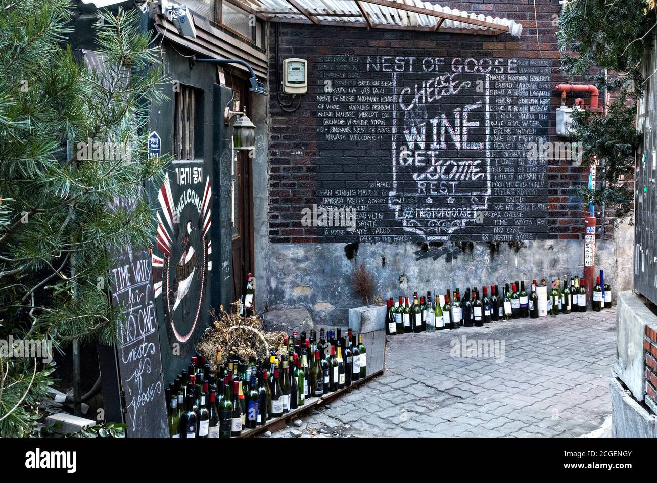 A trendy wine bar inside a traditional Korean Hanock style house in the ...