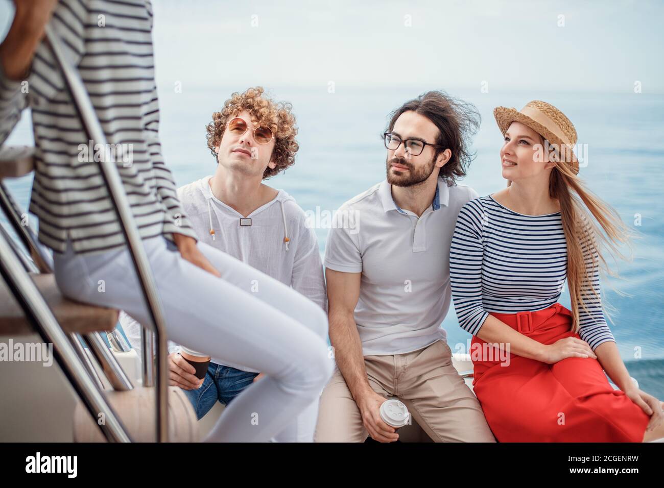 acation, travel, sea, friendship and people concept - friends talking ...