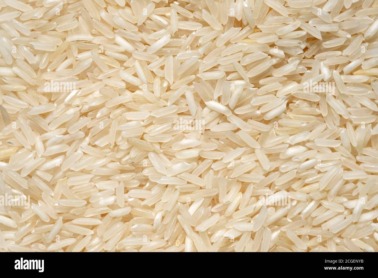 Long grain rice top view. Dry white rice grains close up background ...