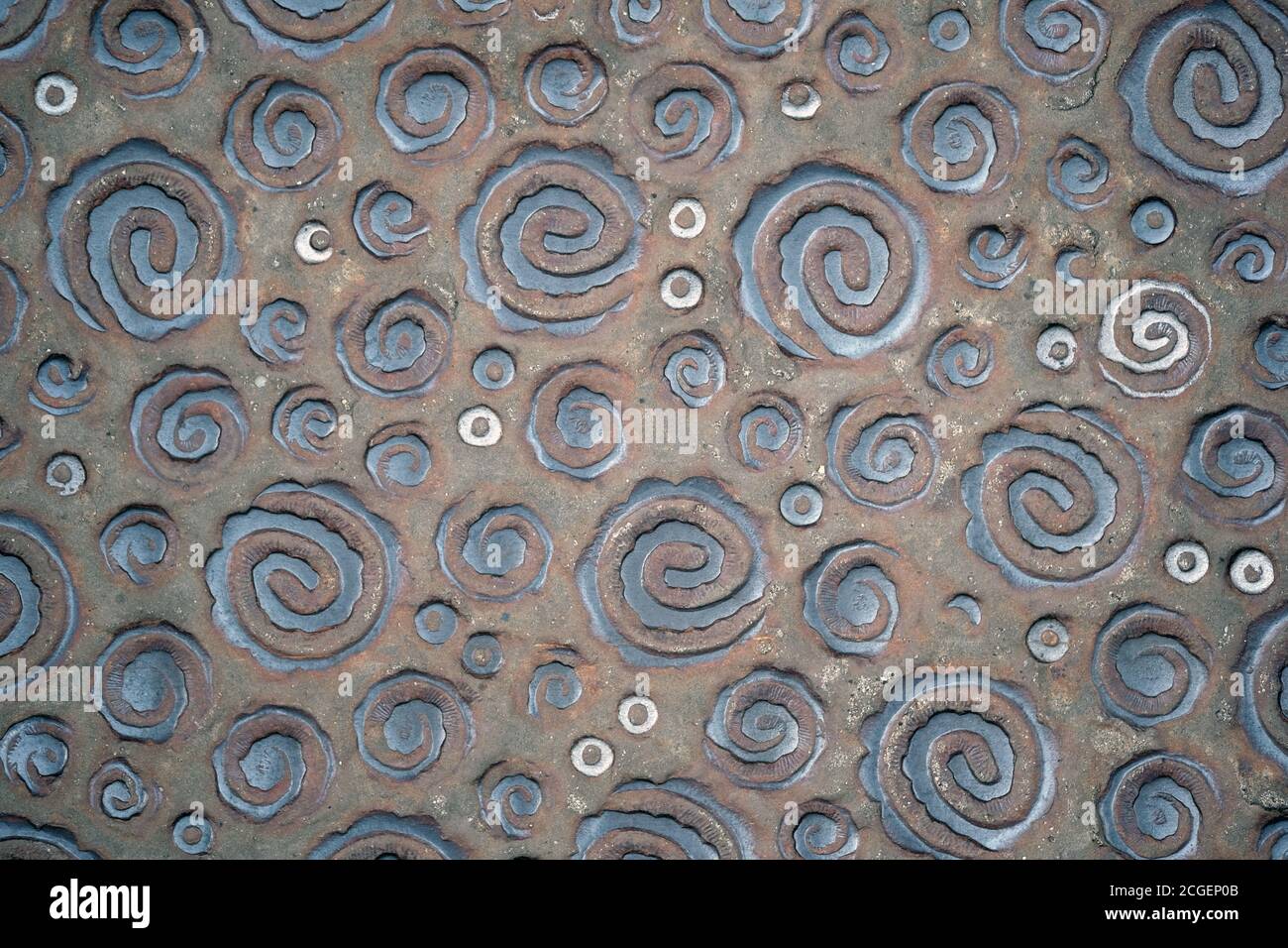 Metal surface with embossed curls in relief. Metal sheet with curls ...