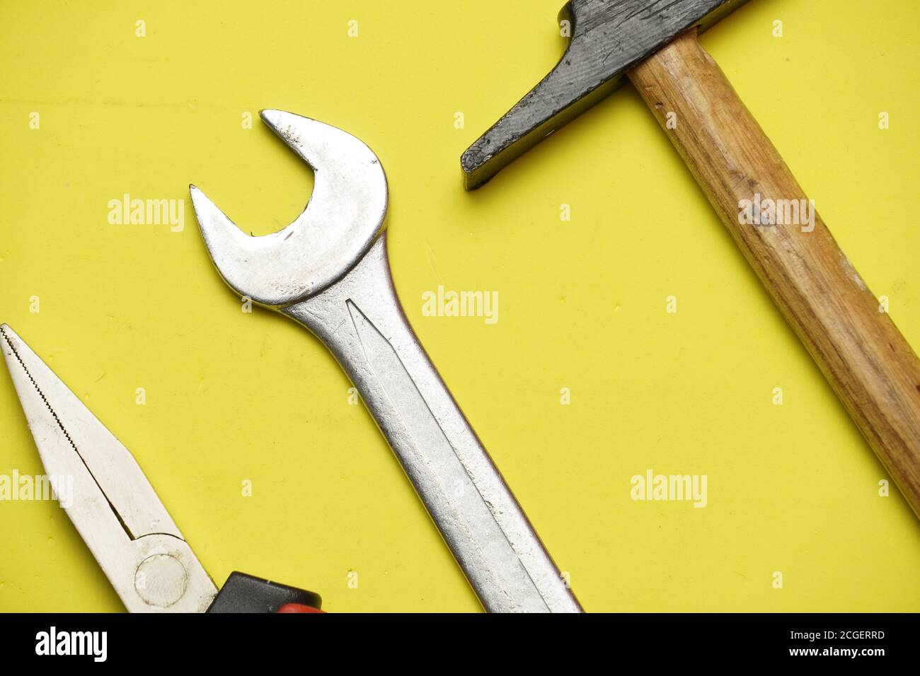 top view of tools on yellow flat background. repair or maintenance ...
