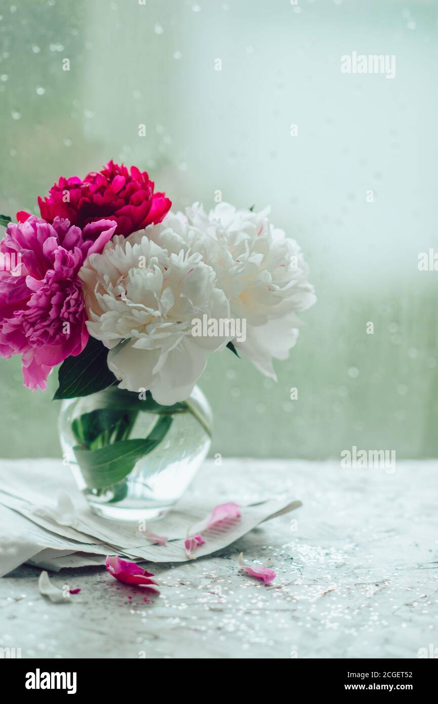 vertical image of a bouquet of fresh lush fragrant multi-colored ...