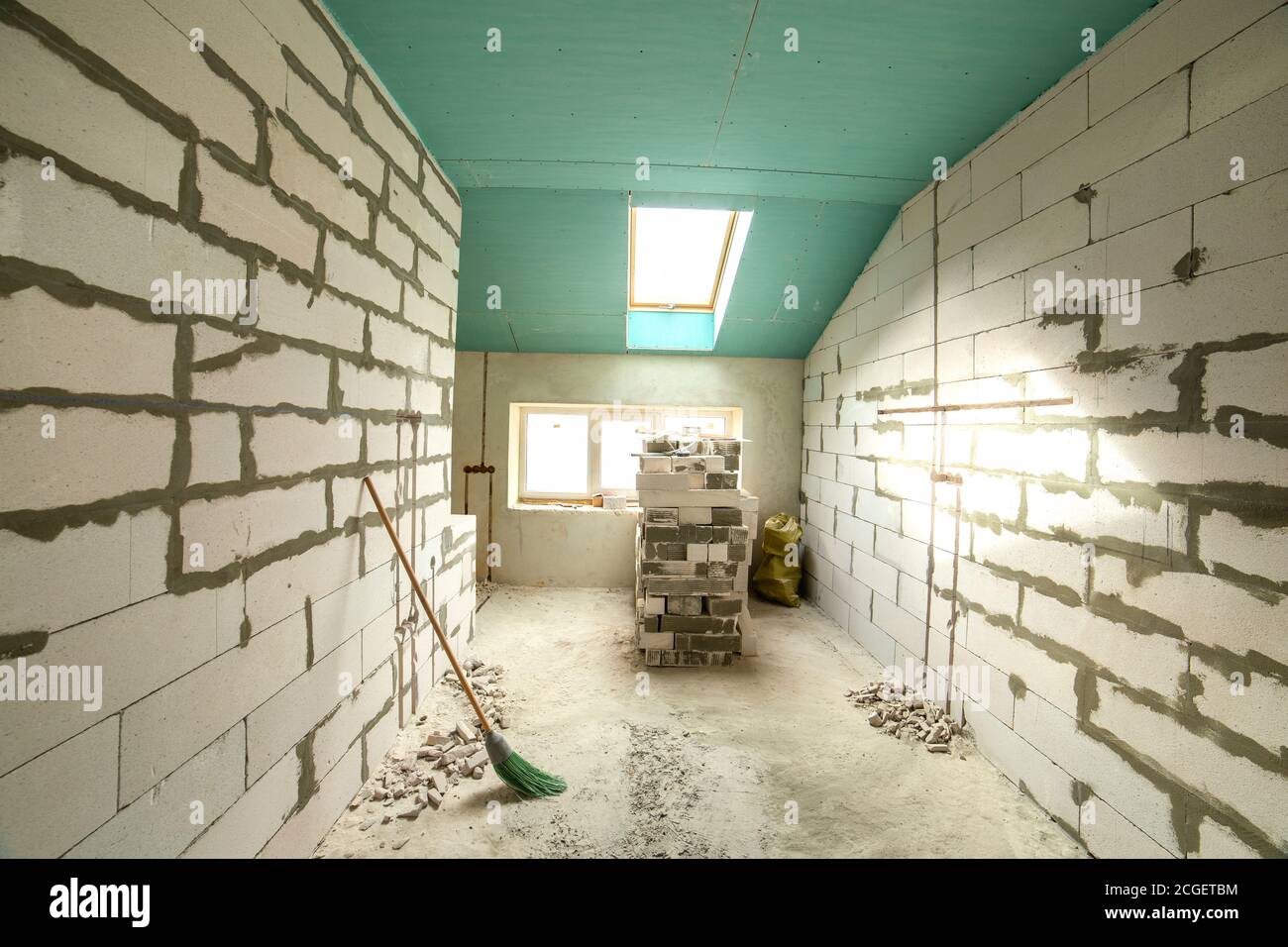 Interior of an apartment room with bare walls and ceiling under ...
