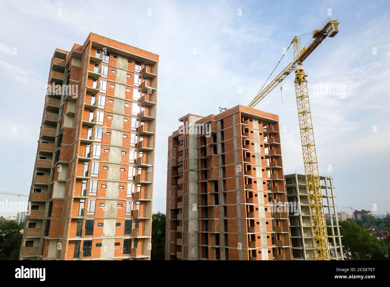 High-rise residential apartment buildings and tower crane under ...