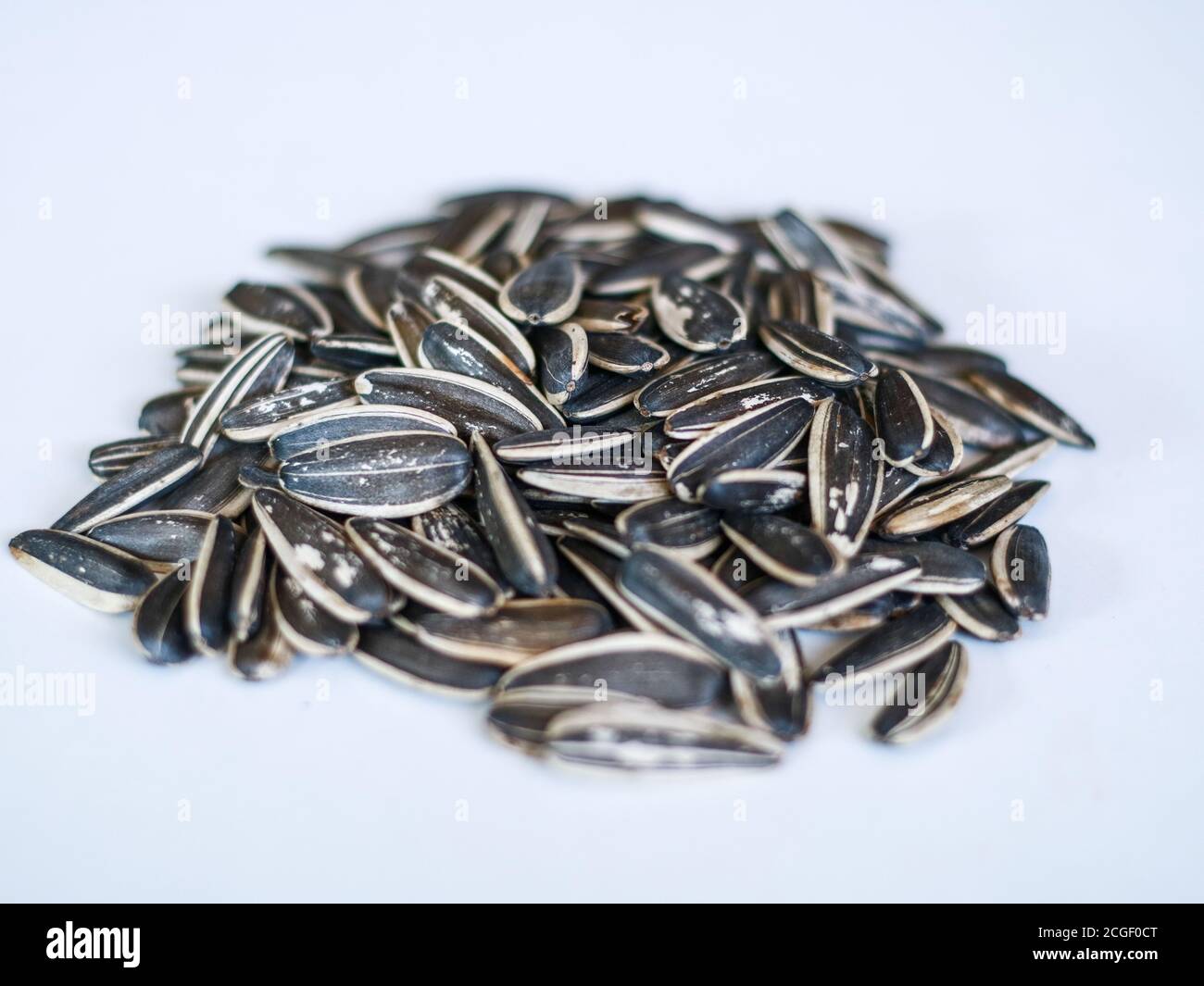Sunflower seed snack or kuaci on white background Stock Photo - Alamy