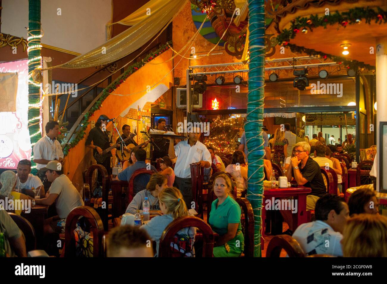 Street scene of 5th Avenue at night with a restaurant in Playa del ...