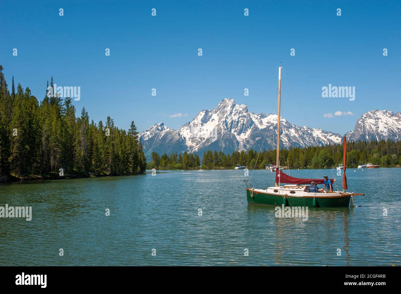 A sailboat in Colter Bay on Jackson Lake in the Grand Teton National ...
