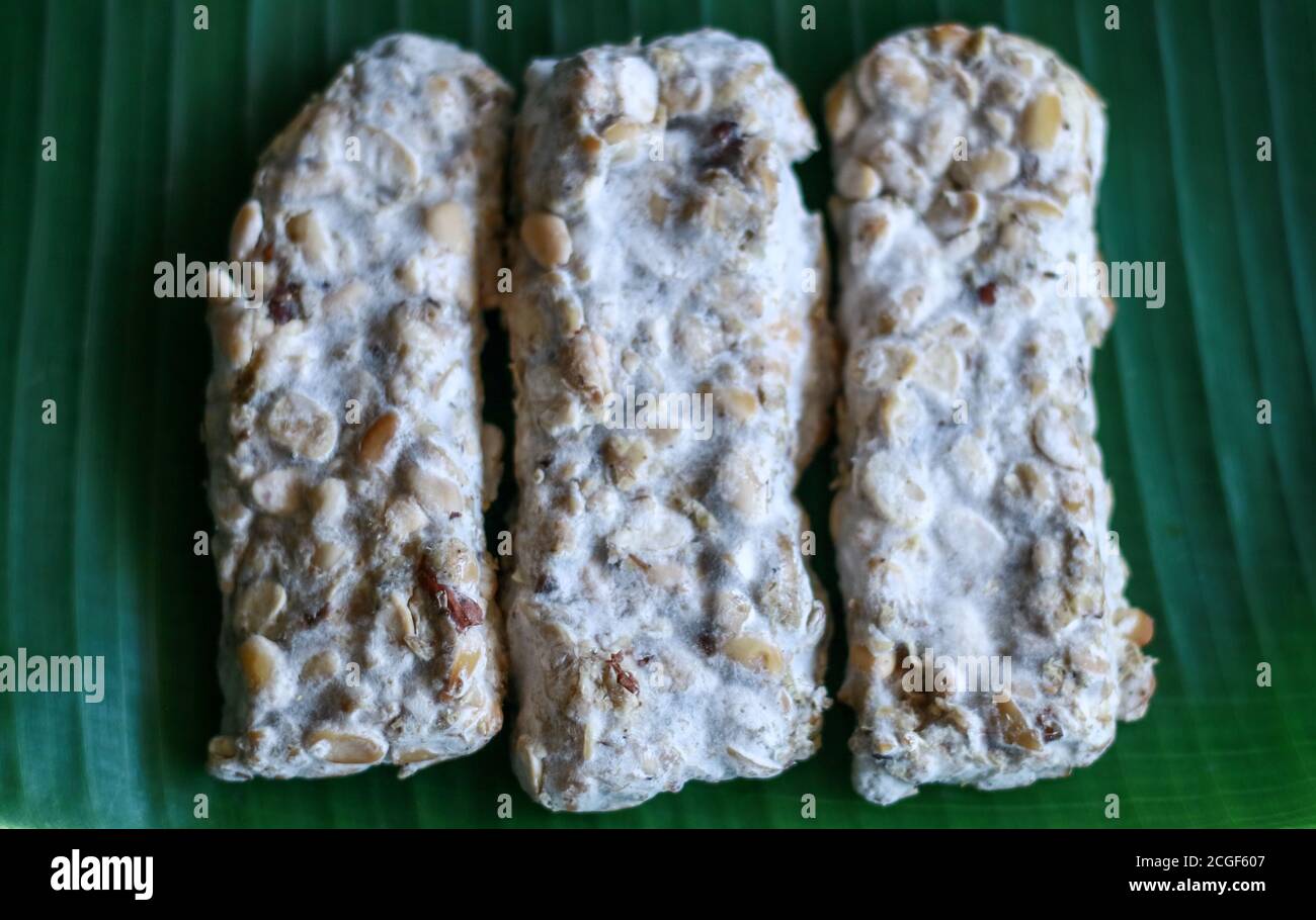 Black oncom on banana leaf background. Oncom is one of the traditional ...