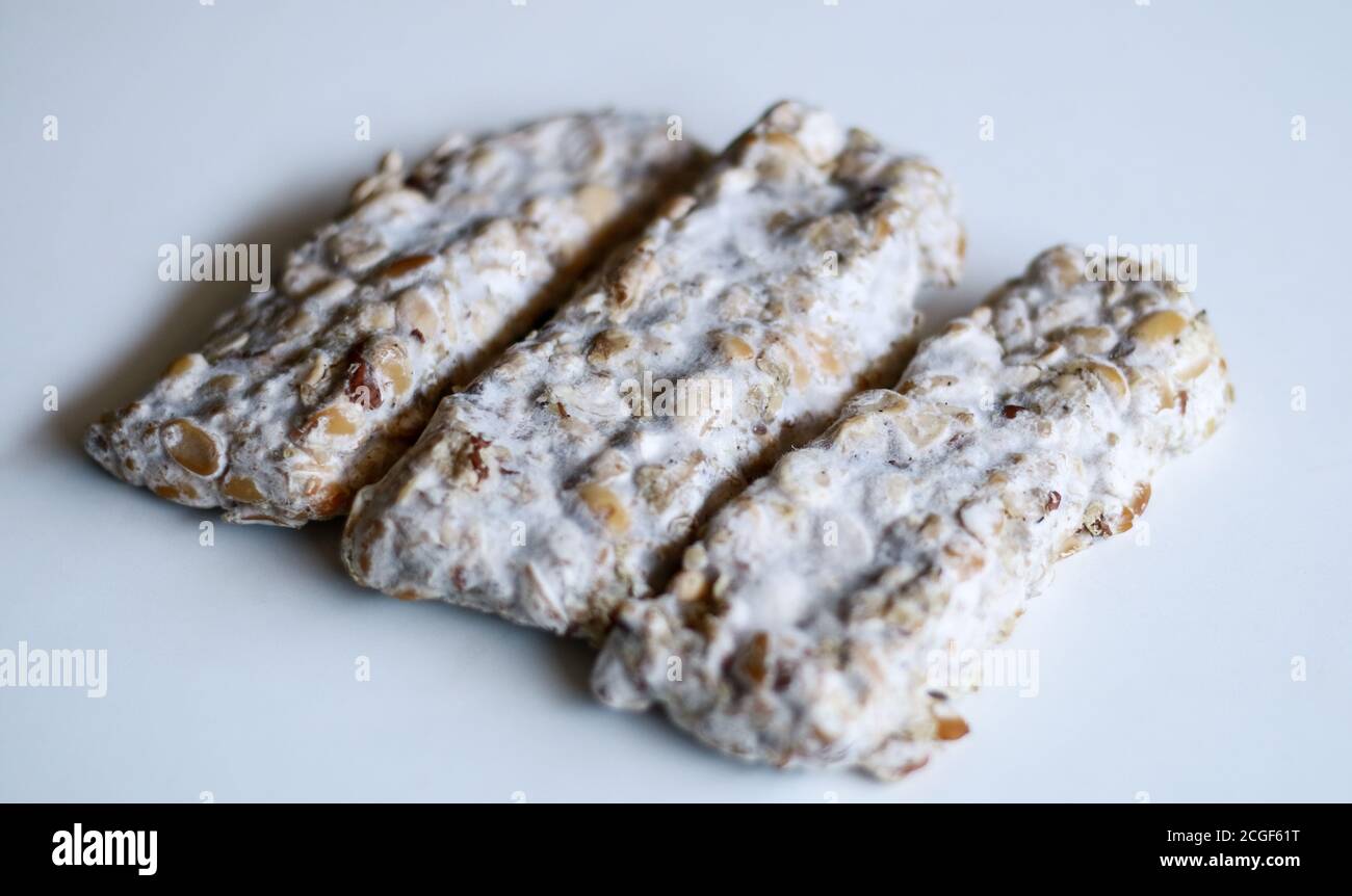 Black oncom on white background. Oncom is one of the traditional staple ...