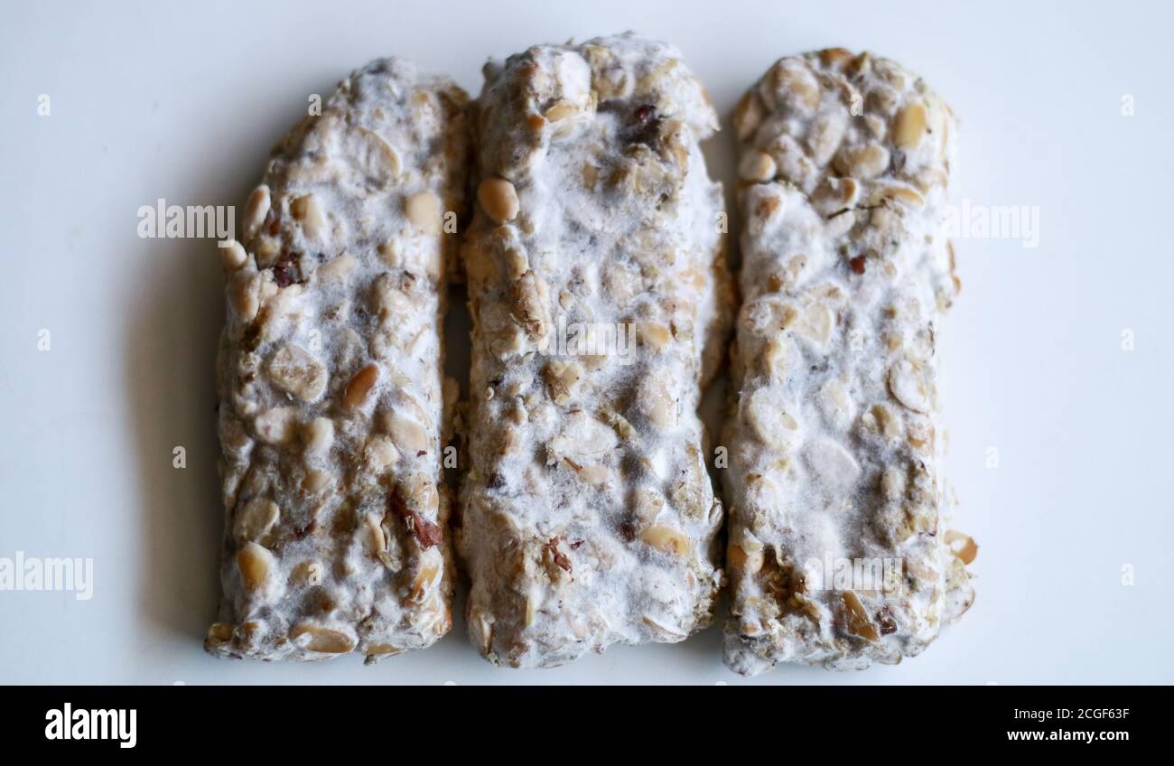 Black oncom on white background. Oncom is one of the traditional staple ...