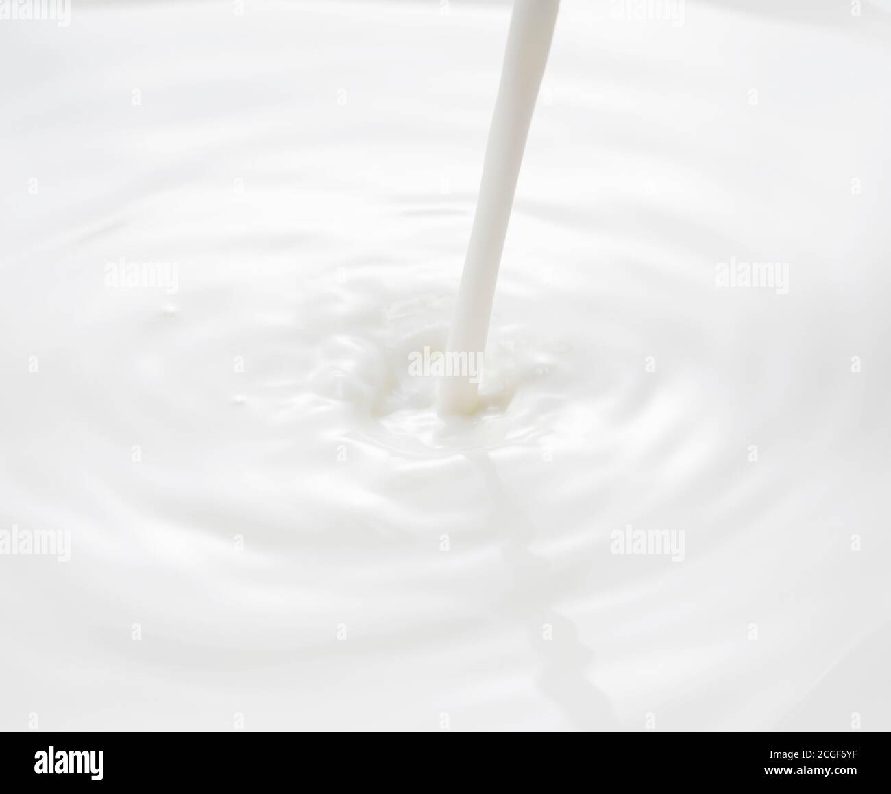 A close-up of the milk pouring place. Waves and Splashes Stock Photo ...