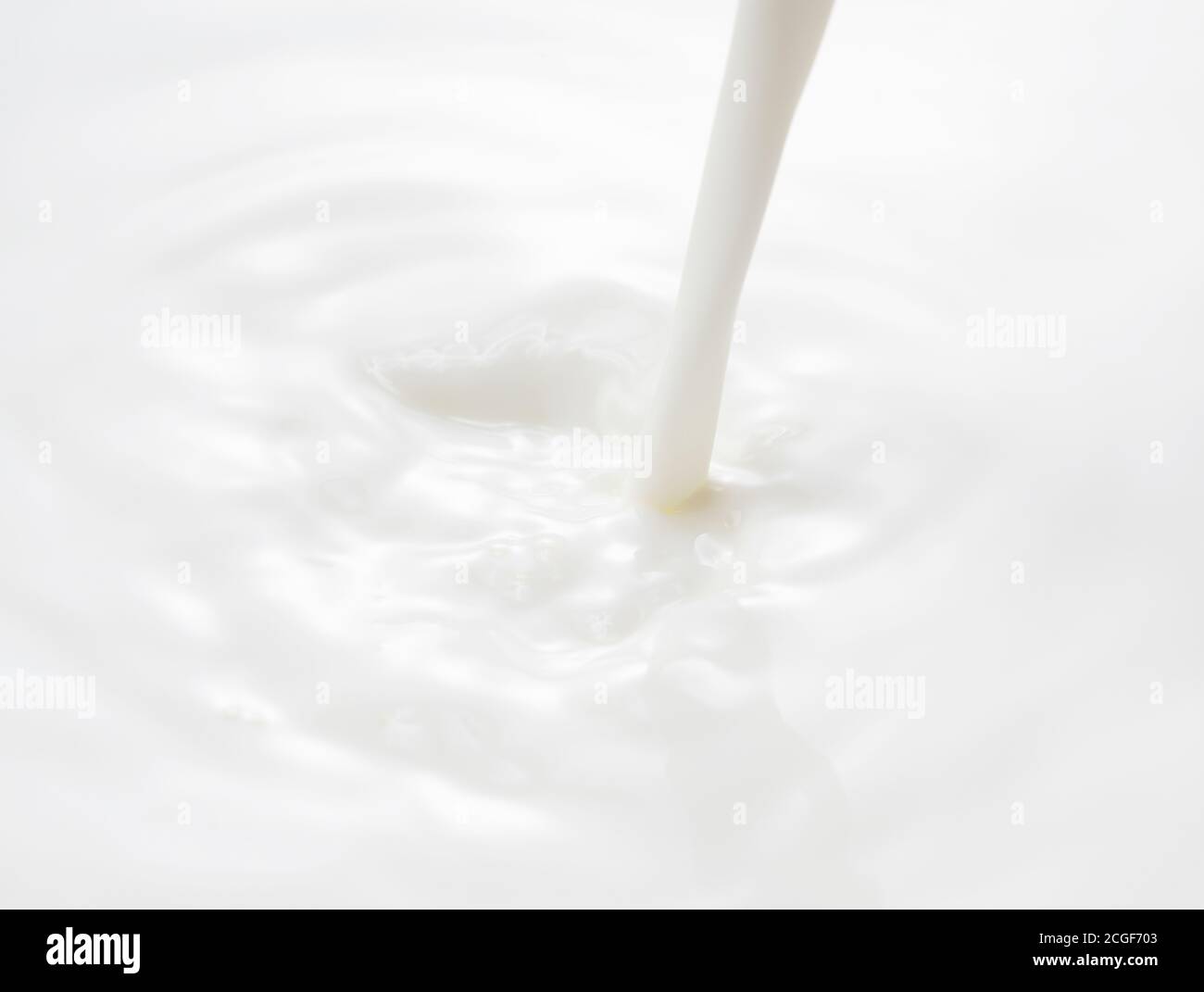 A close-up of the milk pouring place. Waves and Splashes Stock Photo ...