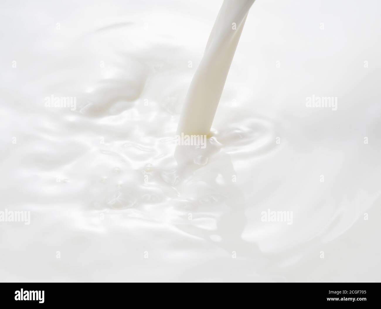 A close-up of the milk pouring place. Waves and Splashes Stock Photo ...