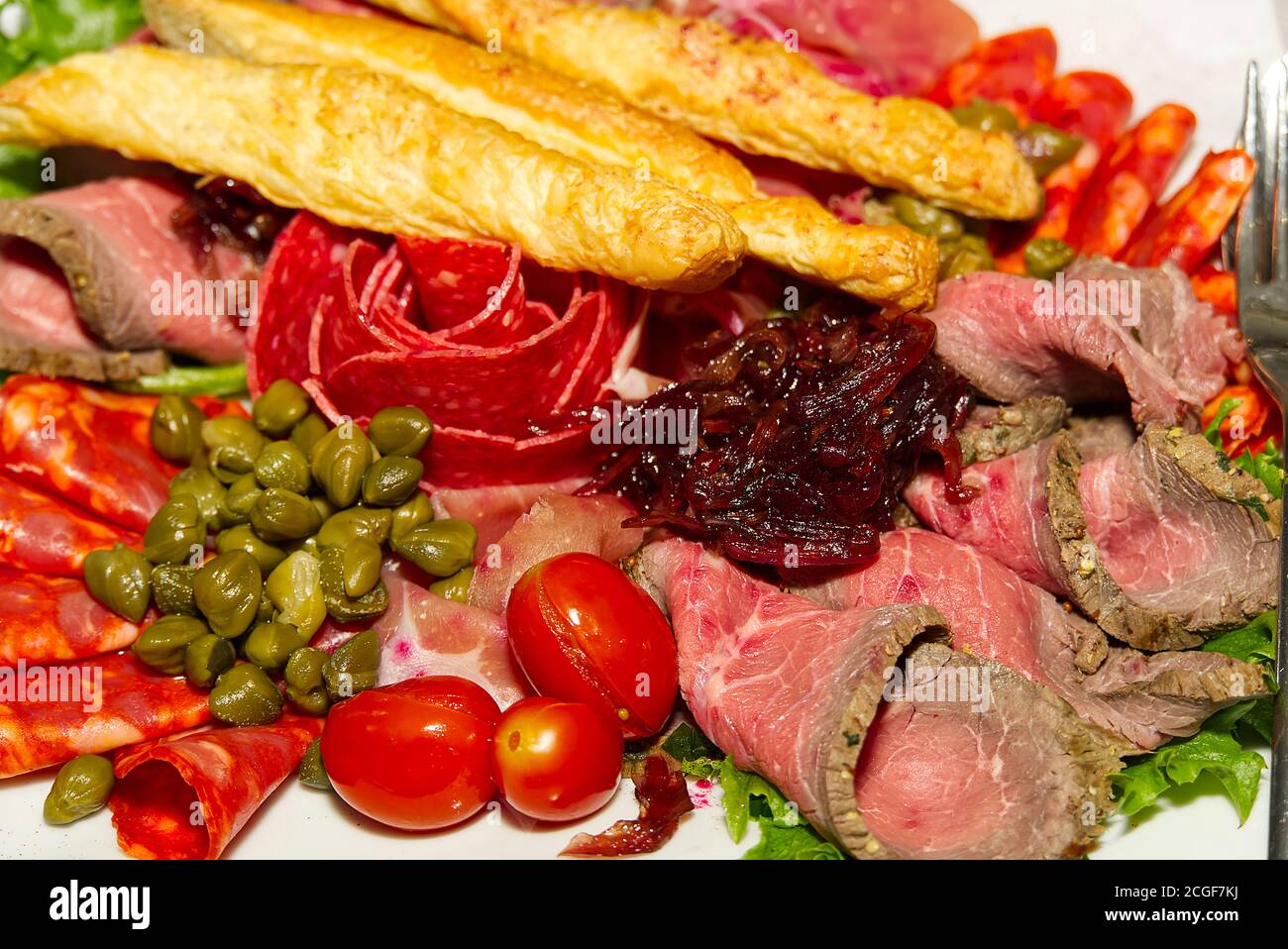 Meat plate antipasti in a restaurant. Party Platter of Assorted Cured ...