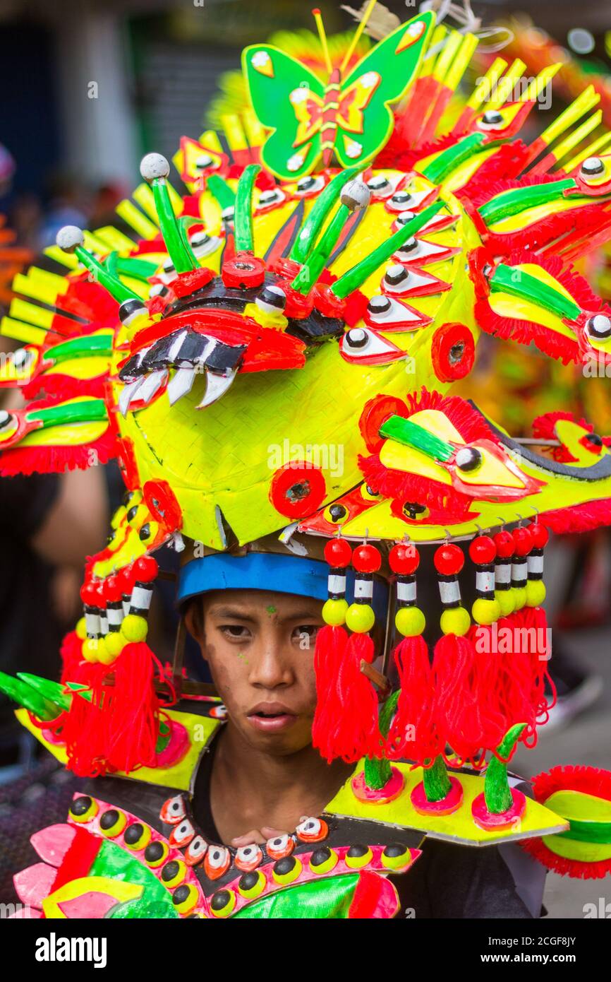 A reveler in costume during the Ati-atihan Festival in Kalibo, Aklan ...