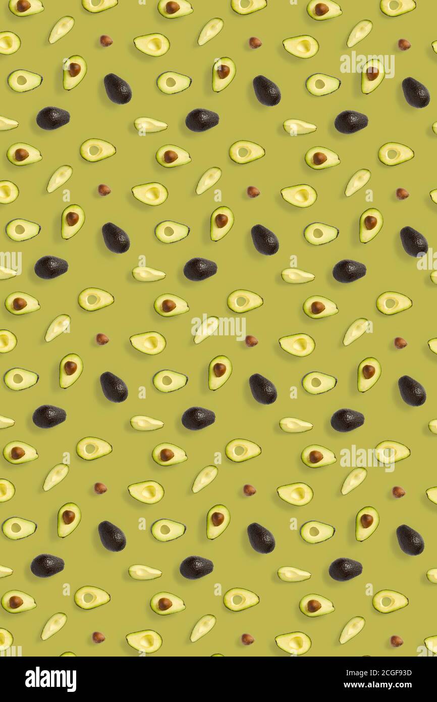 Avocado. Background made from isolated Avocado pieces on olive color ...