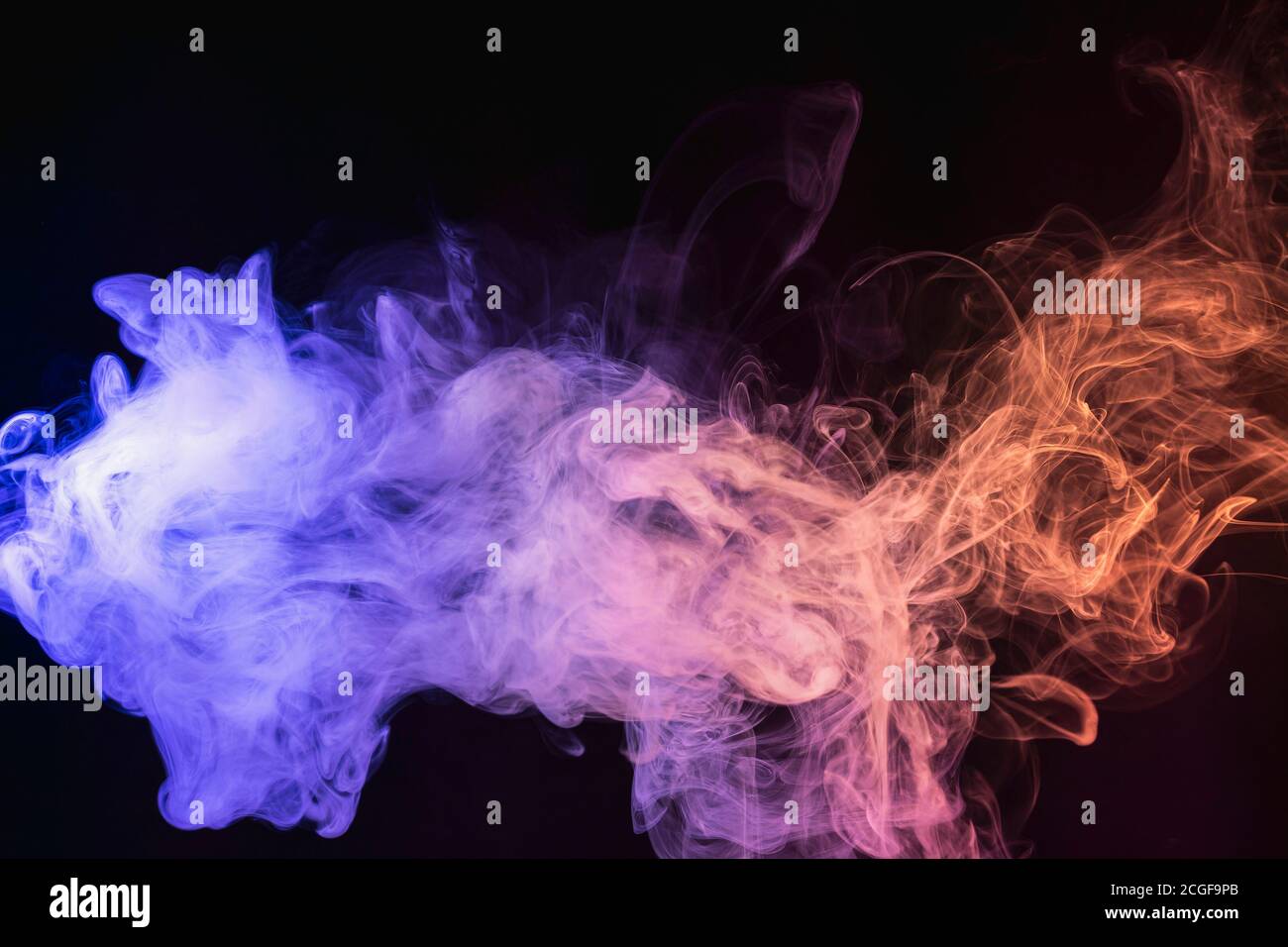 Abstract blue, red and purple smoke on black isolated background. Stop ...